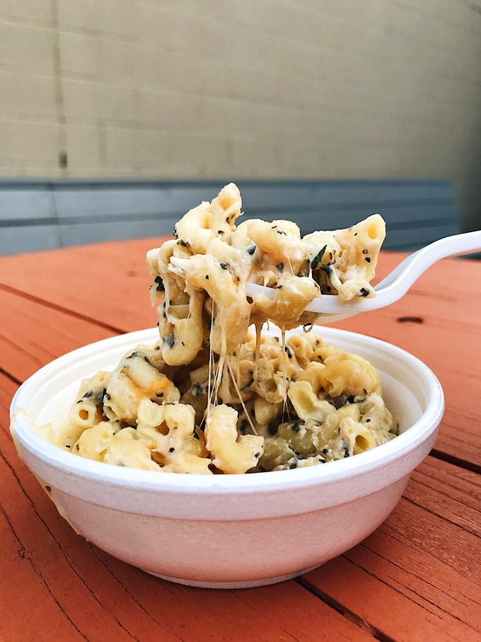 Mac and cheese that stretches like it's auditioning for a dairy commercial. This isn't a side dish&mdash;it's the supporting actor that steals the scene.