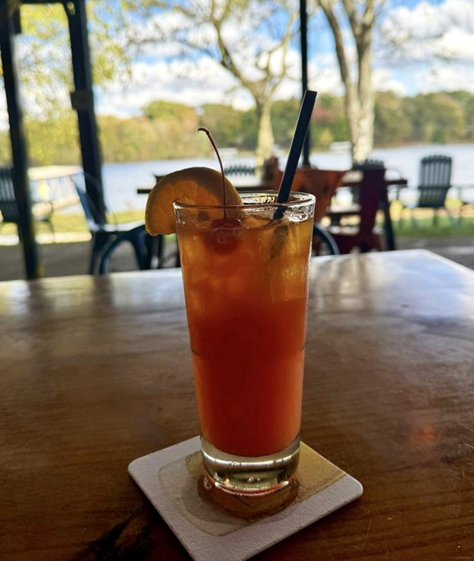 This sunset-colored mai tai isn't just a drink; it's a vacation in a glass, with the lake view providing the perfect backdrop for sipping slowly.