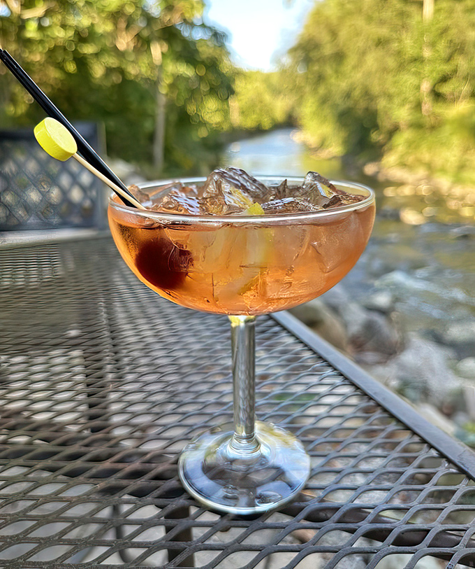 A cocktail with a view &ndash; this Manhattan looks even better against the backdrop of the actual creek that gives the tavern its name.