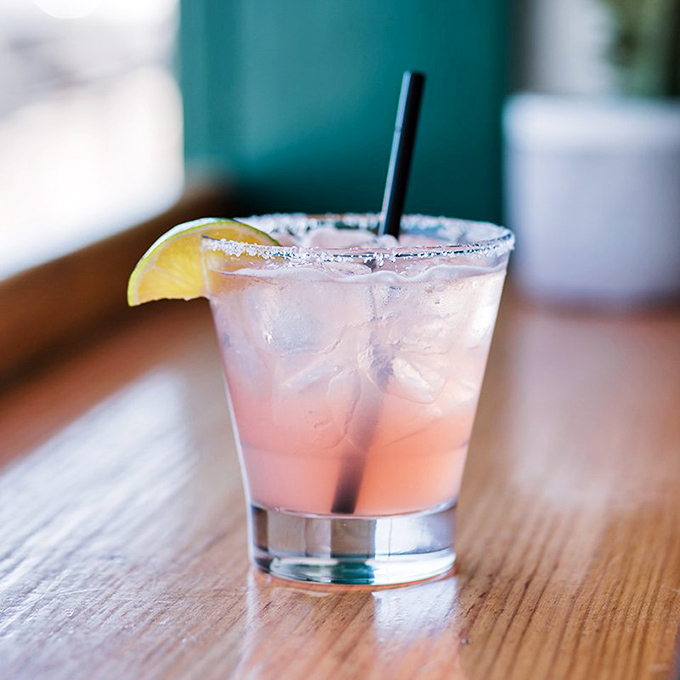 A sunset-hued cocktail that tastes like vacation&mdash;the salt rim and lime wedge promising momentary escape with each sip.