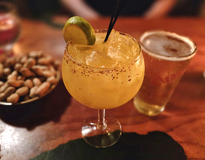 A margarita that means business, rimmed with spices and served alongside peanuts – because proper drinking requires proper snacking.