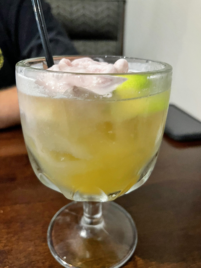 This sunshine-yellow cocktail with a lime garnish isn't just a drink&mdash;it's vacation in a glass, no passport required.