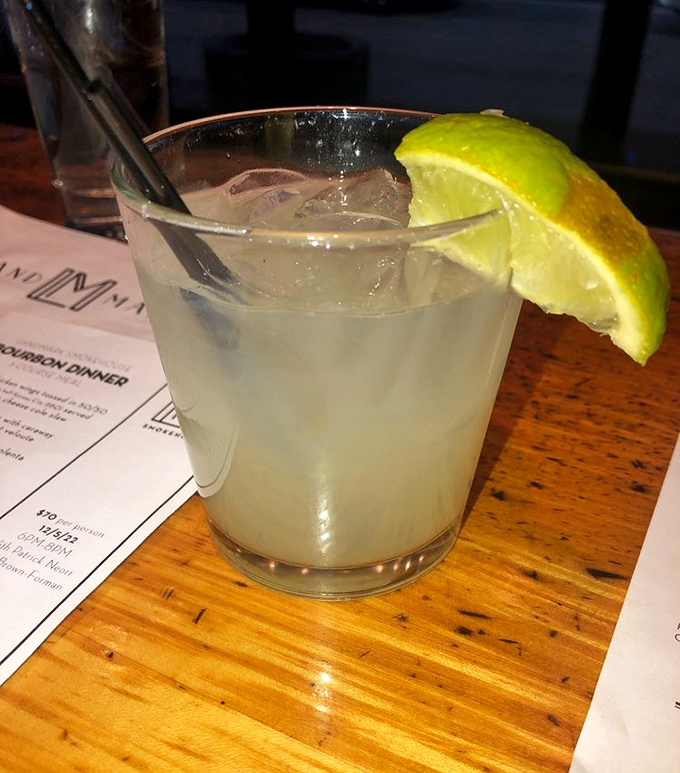 A proper margarita with a fat lime wedge&mdash;because sometimes you need something tart and refreshing to cut through all that smoky richness.