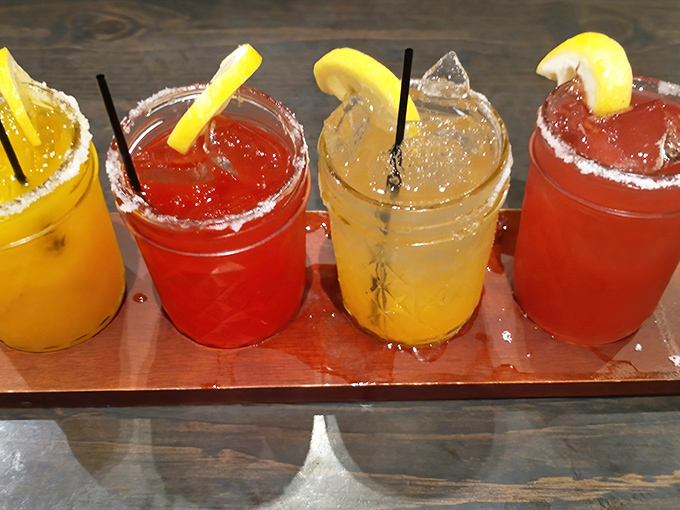 A flight of colorful margaritas with salt-rimmed glasses &ndash; because sometimes you need something bright and zingy to cut through all that smoky richness.