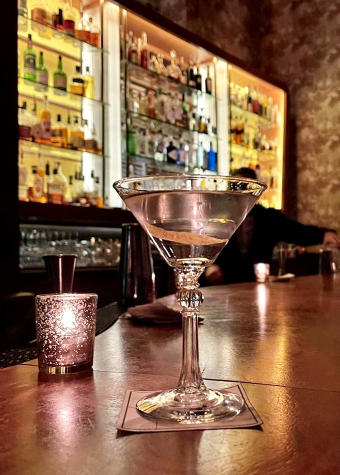 A proper martini at Butcher and Singer isn't just a drink&mdash;it's liquid architecture, glistening with possibility against the amber glow of the bar.