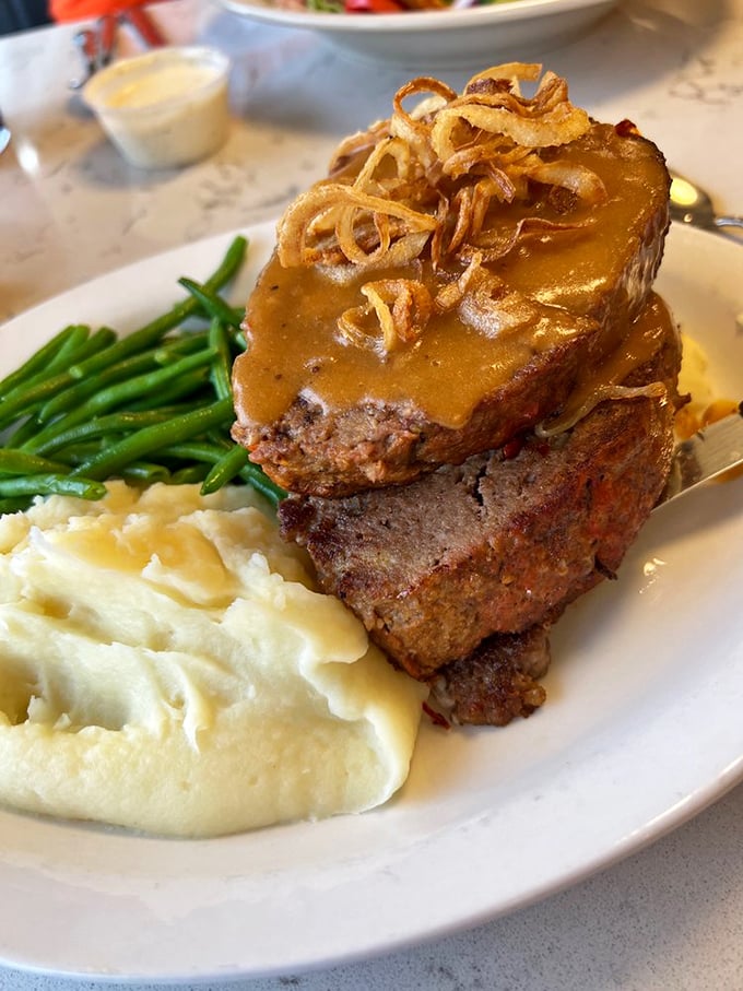 Meatloaf that would make your grandmother simultaneously proud and jealous. Those crispy onion strings on top are the crown jewel of comfort food royalty.