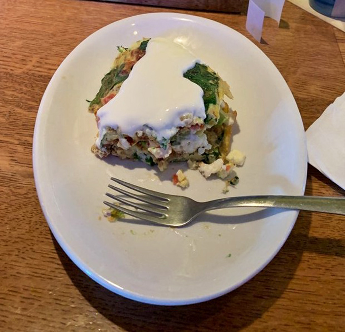 This isn't just an omelet; it's a Mediterranean vacation on a plate, complete with creamy sauce that'll have you plotting your next visit.