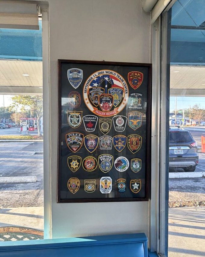 Beyond food, Mama's Kitchen honors service with this thoughtful display of police patches, including a tribute to fallen 9/11 heroes.