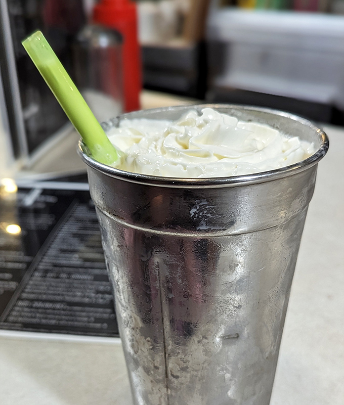 That milkshake comes in a proper metal cup because some traditions are too perfect to modernize.