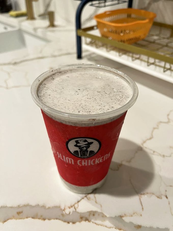 That classic red cup holds liquid happiness&mdash;a milkshake thick enough to require serious straw commitment but worth every bit of the effort.