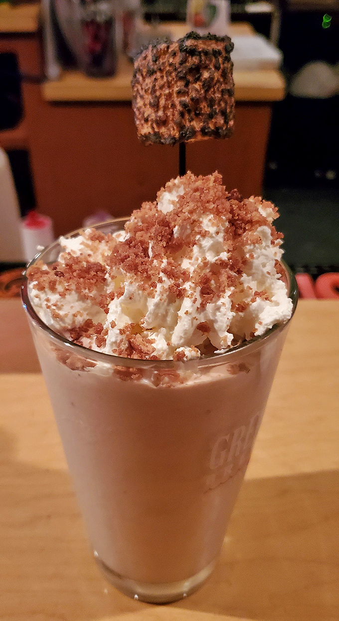 Dessert or work of art? This towering milkshake with its toasted marshmallow hat demands to be photographed before it's devoured.