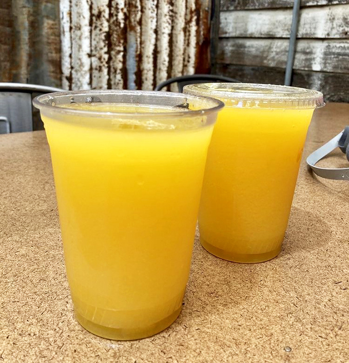 Weekend mimosas served in plastic cups&mdash;because sometimes the best champagne experiences come without crystal flutes.