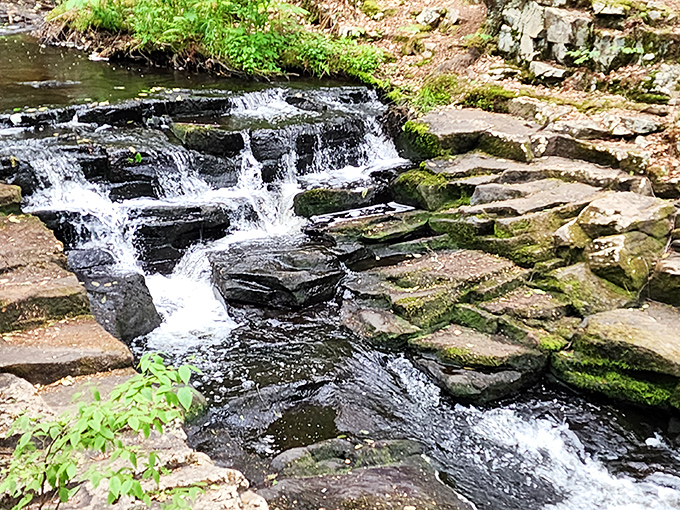 Water tumbling over ancient Pocono stones creates nature's own symphony. This little cascade might not make National Geographic, but it'll certainly make your day.