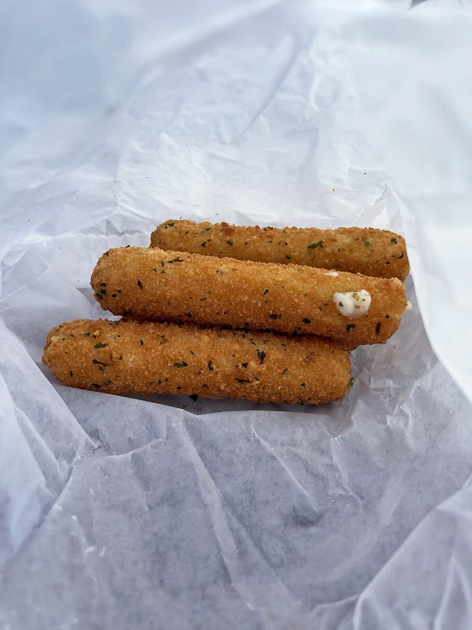 These mozzarella sticks aren't just fried cheese&mdash;they're golden vessels of molten joy that stretch dramatically with each bite, demanding their own slow-motion sequence.