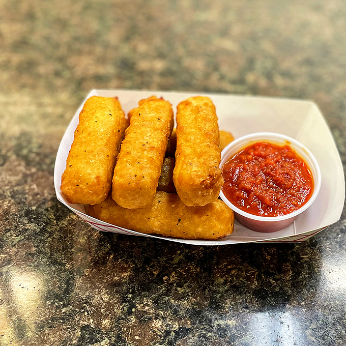 Melted mozzarella pulls like a cheesy accordion, playing your favorite tune: "More, Please."