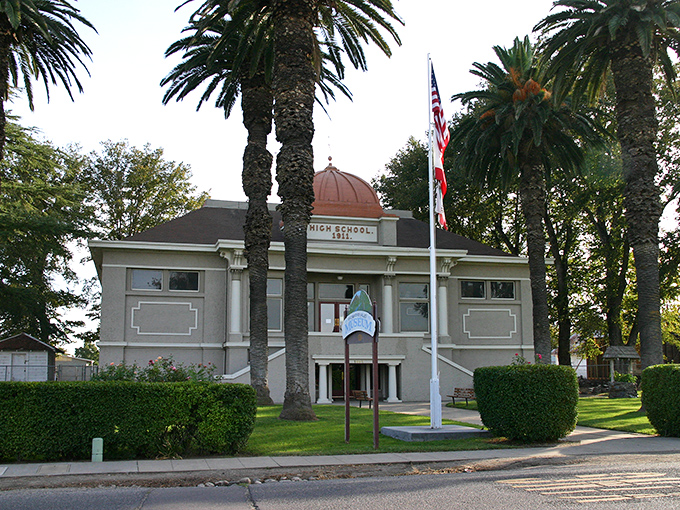 The historic high school building stands proudly among palm trees, a architectural time capsule from when schools were built to inspire rather than just contain.