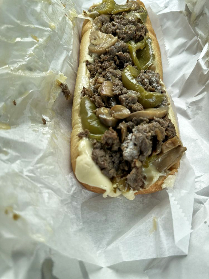 This isn't just a cheesesteak—it's a love letter written in beef, peppers, and melted cheese on a perfectly toasted roll.