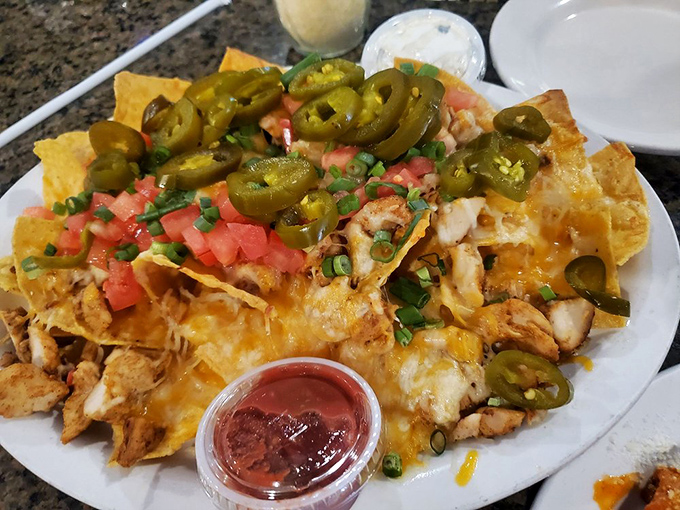 These aren't just nachos&mdash;they're a fiesta of textures and flavors where jalape&ntilde;os, tomatoes, and melted cheese throw the kind of party your taste buds talk about for days.