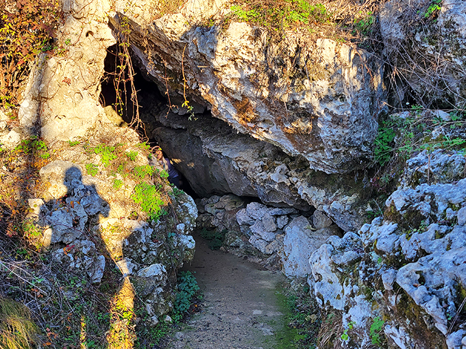 Nature's own secret passage beckons adventurers. This limestone corridor looks like something from an Indiana Jones movie, minus the booby traps.