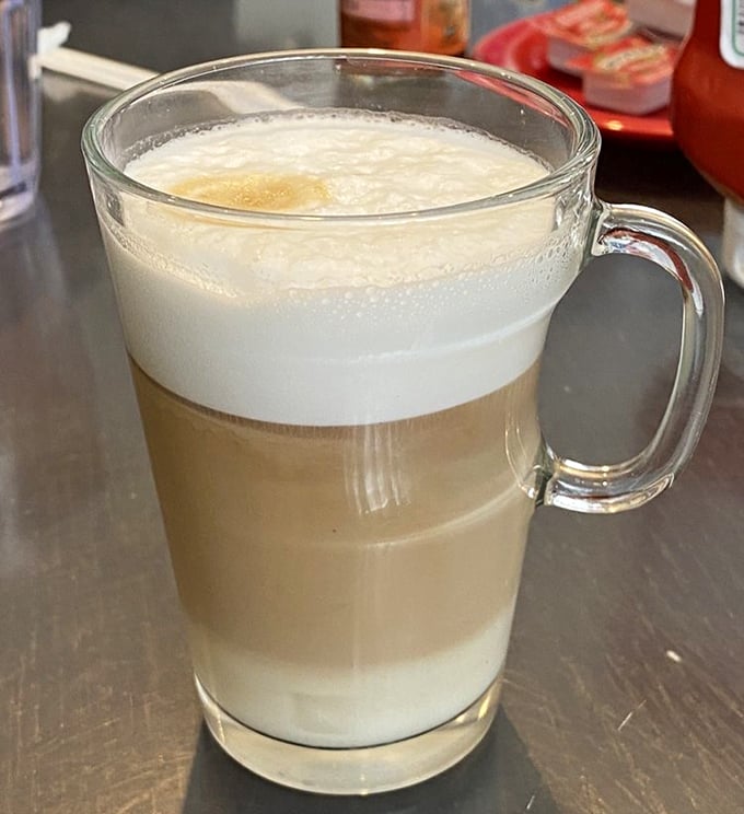 Coffee isn't just a beverage here – it's liquid motivation artfully layered in glass. The kind of morning fuel that makes you believe in possibilities.