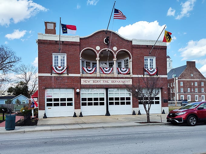 The New Bern Fire Department stands proudly decorated with flags, a testament to small-town pride and the heroes who protect it.