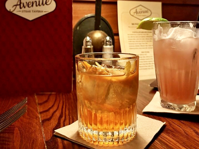 An Old Fashioned that Don Draper would approve of, sitting pretty next to what appears to be its blushing pink cocktail cousin.