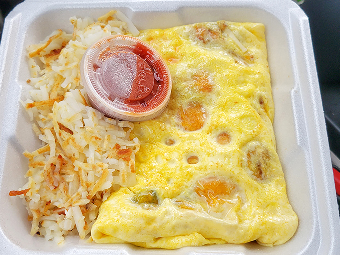 The to-go omelet box &ndash; proof that good things come in simple packages. Those hash browns are the unsung heroes of the breakfast world.