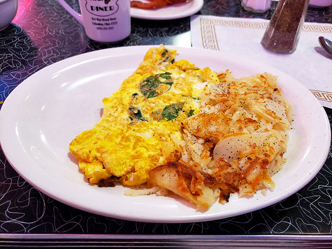 This isn't just an omelet&mdash;it's a golden envelope stuffed with a love letter to breakfast, served with crispy potatoes as the perfect PS.