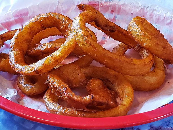These onion rings aren't playing around. Golden-brown halos of happiness that shatter with each bite&mdash;worth every calorie and every napkin.