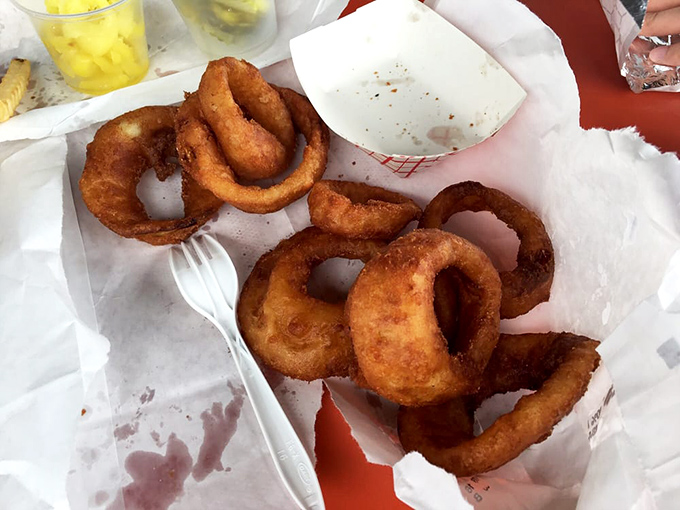 These aren't just onion rings; they're golden halos of crispy perfection that complement any sandwich choice with their satisfying crunch.