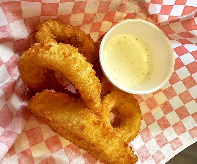 These onion rings achieve that perfect balance between crispy coating and sweet, tender onion that dreams are made of.