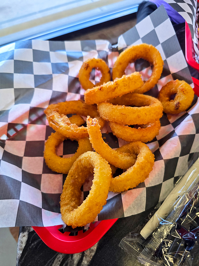 Golden onion rings that prove some classics never need fixing, just perfect execution.