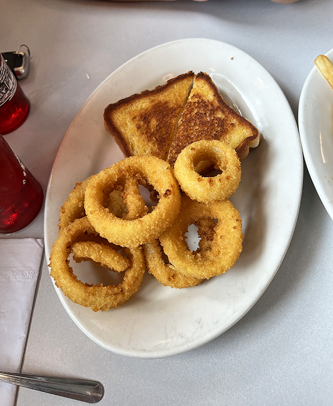 Onion rings the size of bracelets with a golden crunch that announces itself to everyone within earshot&mdash;comfort food jewelry at its finest.