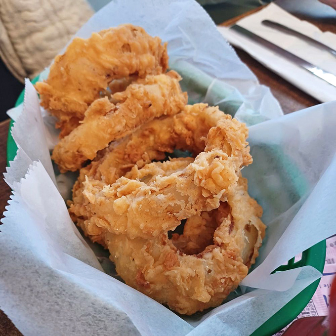 Golden-battered rings of joy! These onion rings aren't just a side dish&mdash;they're crispy halos celebrating Indiana's comfort food heritage.
