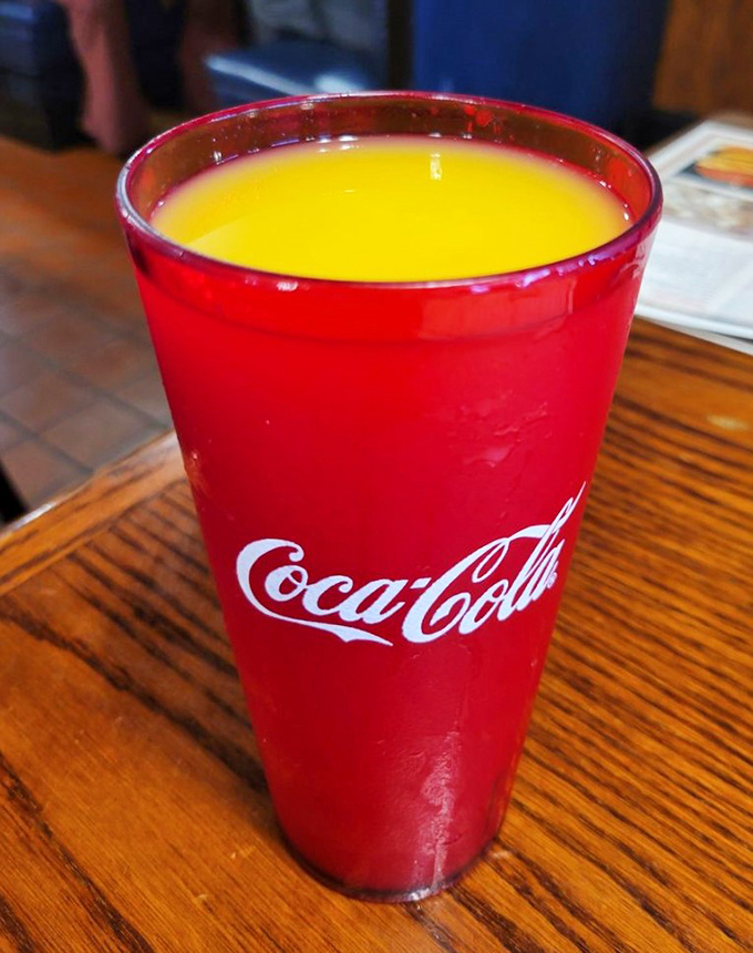 That's not just orange juice&mdash;it's liquid sunshine served in a classic Coca-Cola glass, the perfect companion to cut through the richness of Marie's hearty breakfast offerings.
