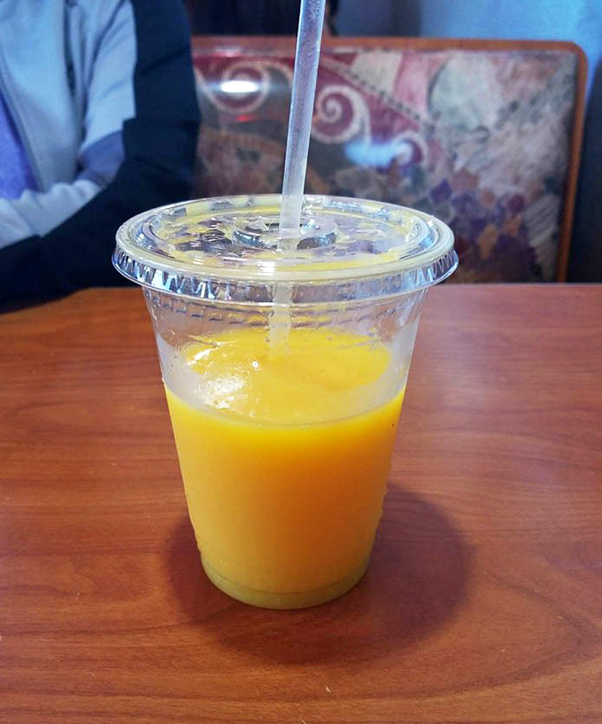 Fresh-squeezed orange juice so vibrant it could jumpstart your day better than any alarm clock. Sunshine in a cup, no SPF required.
