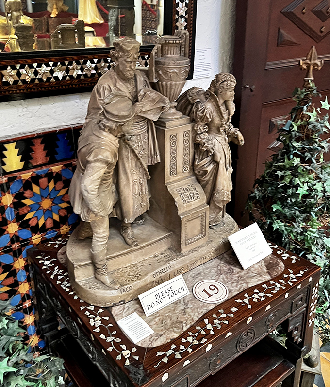 This Othello sculpture sits atop an inlaid table that's practically begging you to play chess while stroking your chin thoughtfully.