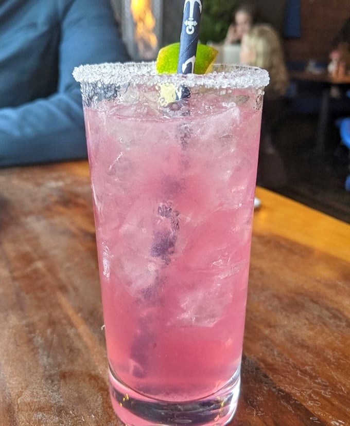 Their pink Pama Margarita isn't just a drink, it's a sunset in a glass that pairs perfectly with bay views.