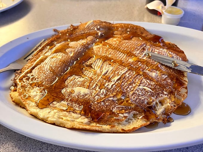 Pancake perfection isn't just about size&mdash;though this plate-eclipsing beauty certainly qualifies&mdash;it's about that golden-brown canvas awaiting syrup artistry.