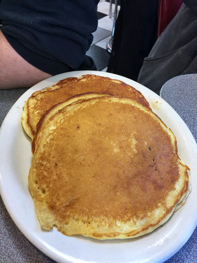 Golden pancakes that could double as frisbees—the perfect breakfast counterpoint to a chili-centric menu.