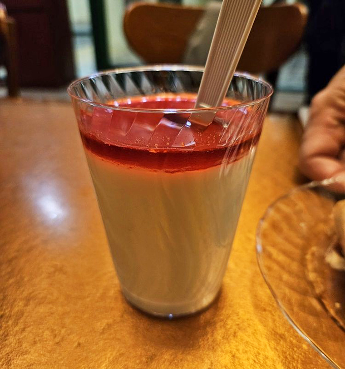 This layered panna cotta with its ruby-red topping isn't just dessert&mdash;it's the sweet finale your taste buds have been patiently waiting for all meal.