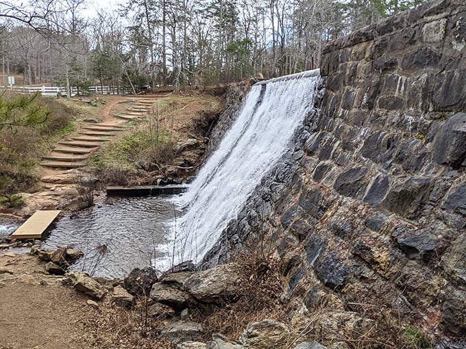The stone dam's cascading waters create a hypnotic visual that's worth pulling over for &ndash; nature's version of meditation in motion.