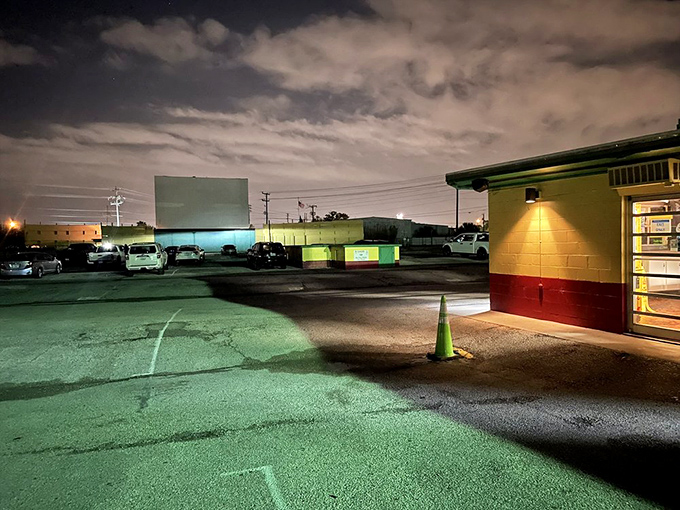 After dark, the Silver Moon transforms into a magical landscape where neon lights and movie beams cut through Florida darkness.