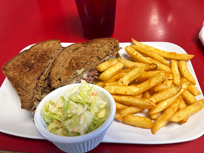 The humble patty melt &ndash; that perfect marriage of beef, cheese, and grilled bread &ndash; flanked by fries so golden they'd make Fort Knox jealous.