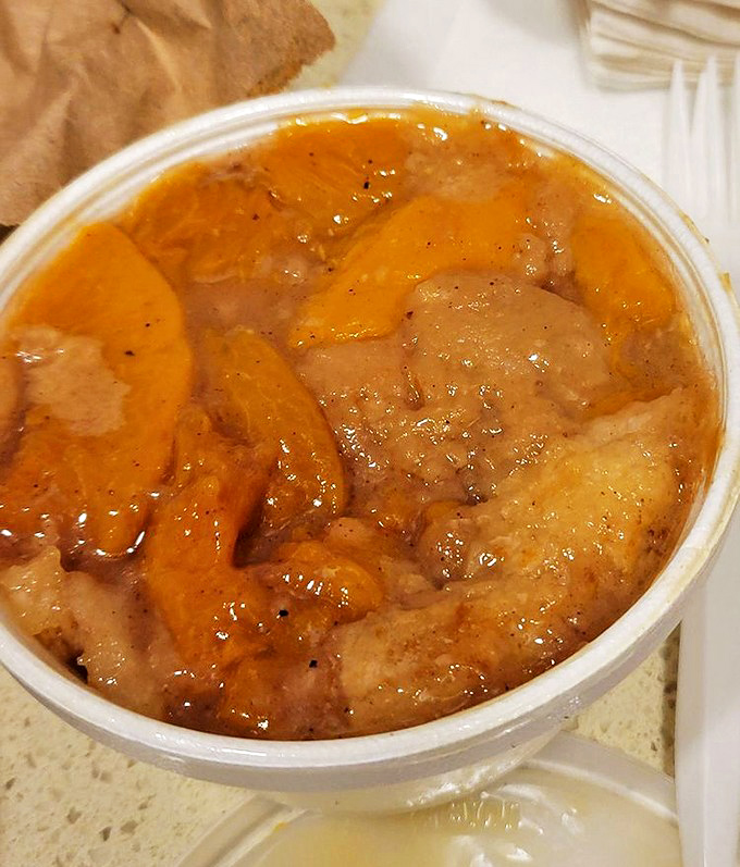 Peach cobbler that tastes like summer decided to settle down in a cup. The kind of dessert that makes you consider licking the container.