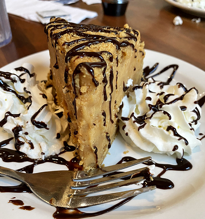 Not just peanut butter pie&mdash;this is what dessert dreams are made of. That chocolate drizzle isn't decoration; it's the exclamation point on a flavor masterpiece. 