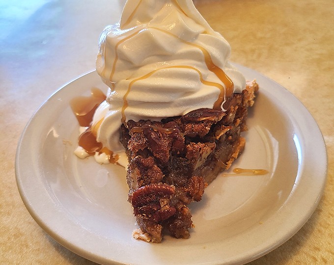Pecan pie topped with a cloud of whipped cream &ndash; the kind of dessert that makes you wonder why anyone bothers with molecular gastronomy.
