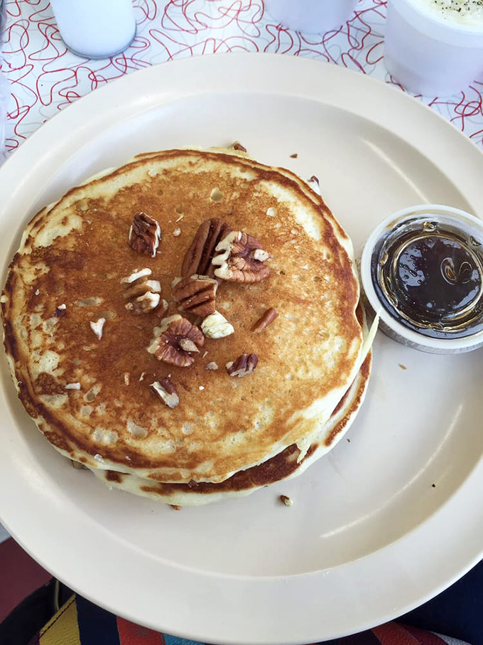 Pecan pancakes stacked high with a side of syrup &ndash; like autumn in Tennessee decided to become breakfast.