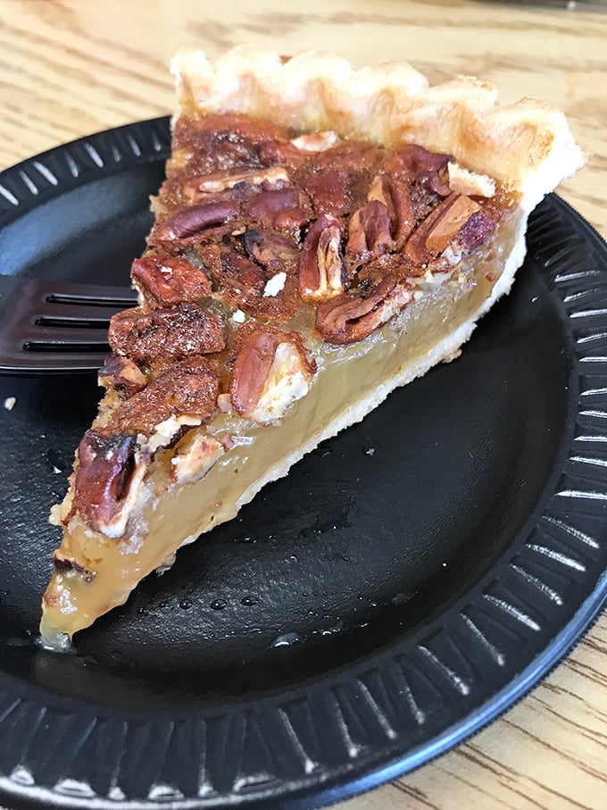A slice of pecan pie that would make your grandmother both proud and jealous. Sweet, nutty perfection on a humble paper plate.