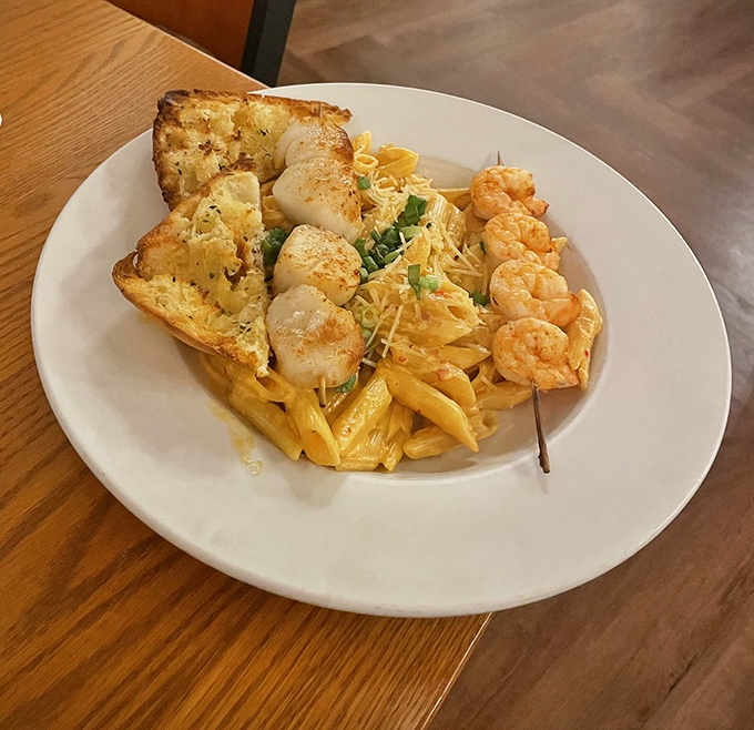 Seafood pasta that makes you question why you ever considered ordering steak, with scallops and shrimp playing the ocean's greatest hits.
